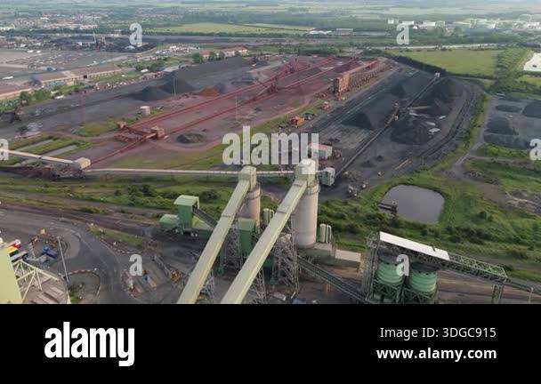 Aerial drone view of huge coal and iron ore storage depot, piles of ...