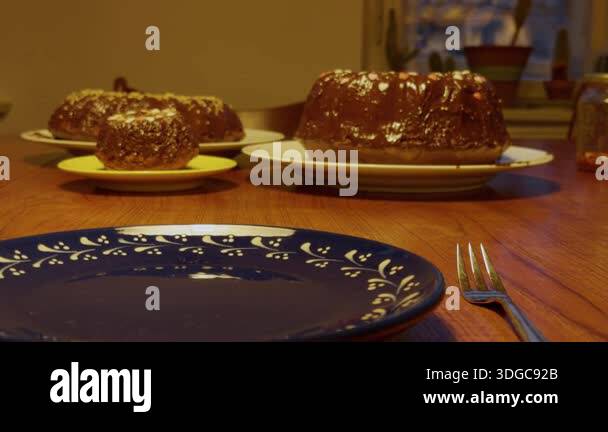 Close-up details of a mother lightning candles on homemade chocolate ...