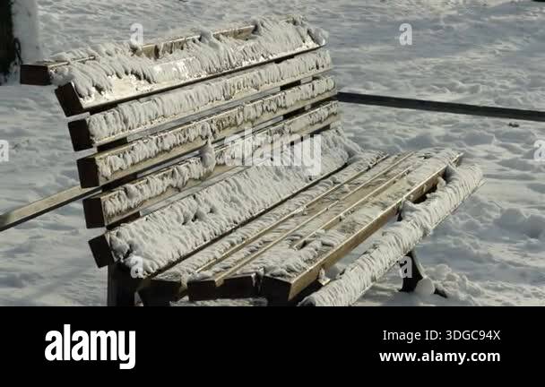 Wide shot of Orange Garbage Bin and Bench on a winter Day in Gorlitzer ...