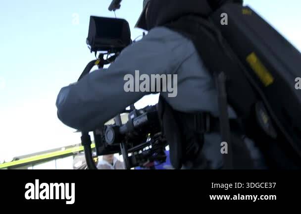 ALMATY, KAZAKHSTAN - SEPTEMBER 28 2025: Cameraman with colleagues work ...