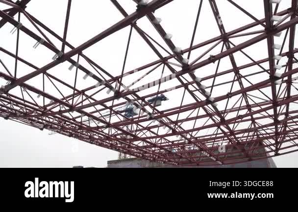 Process of installing metal structural frame shows active construction ...