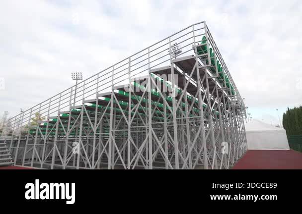 Spectator stand structure built from metal beams stands near stadium ...