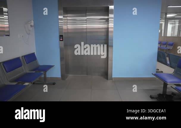 Shiny elevator doors refresh restrained blue reception interior adding ...
