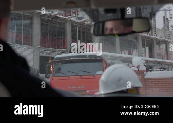ALMATY, KAZAKHSTAN - DECEMBER 07 2025: Construction worker sitting in ...