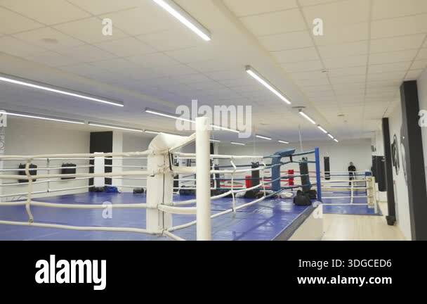 Large boxing ring dominates spacious gym during training preparation ...