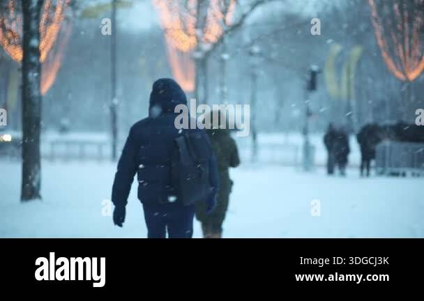 Pedestrians walk through heavy snowfall in Paris during winter ...
