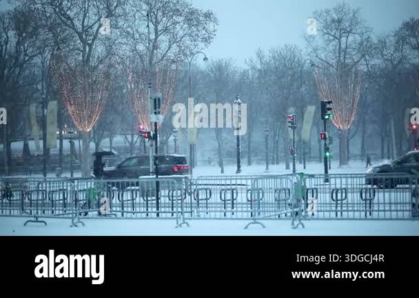 Pedestrians walk through heavy snowfall in Paris during winter ...
