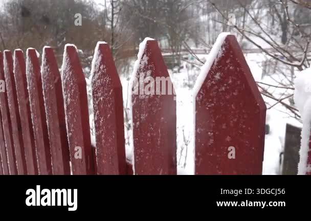 Stockholm, Sweden A red picket fence in a snowstorm Stock Video Footage ...