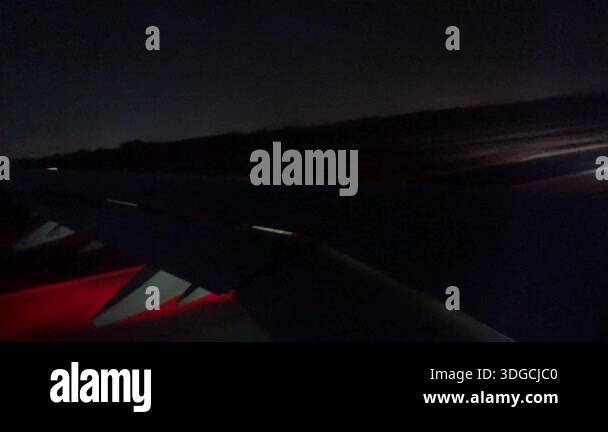 Washington DC USA A passenger jet takes off at Dulles Airport at night ...