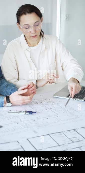 Architects developing a new building project, collaborating and ...