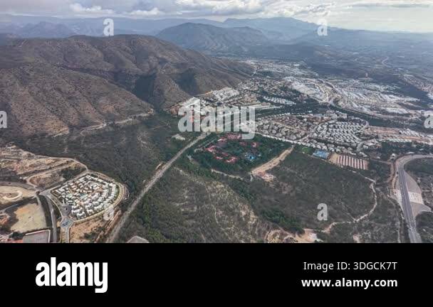 aerial view of planned hillside neighborhoods with curving roads and ...