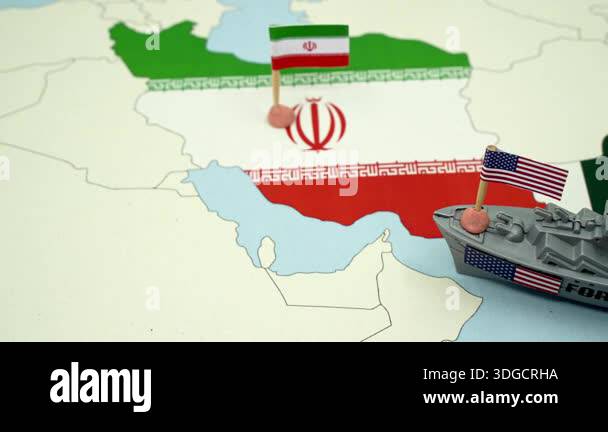 United States and Iran national flags on a geopolitical map with a toy ...
