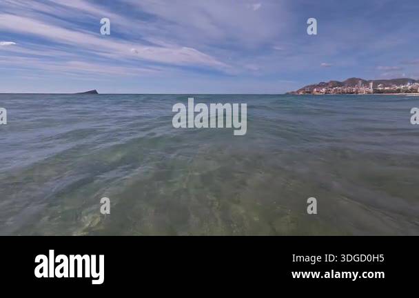 Quiet Ocean Horizon With Gentle Swells And Distant Coastline, Soft Blue ...