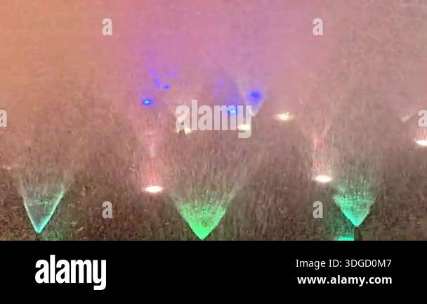 Neon Fountain Water Dance At Night, Colorful Jets And Misty Glow With ...