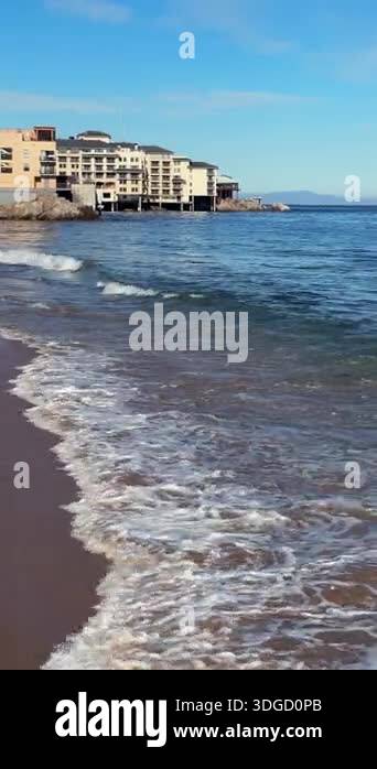 Calm beach waves and oceanfront view on sunny day Stock Video Footage ...