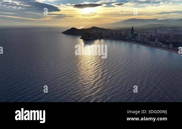 Sunset Glow Casting Long Golden Path Across Calm Evening Sea, Shoreline ...