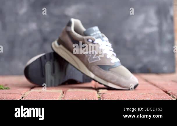 gray New Balance 998 sneakers on brick background. 4K Stock Video ...