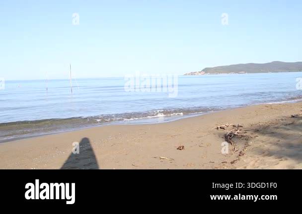 Beautiful scenic view of a wild and empty sandy beach in Albinia ...