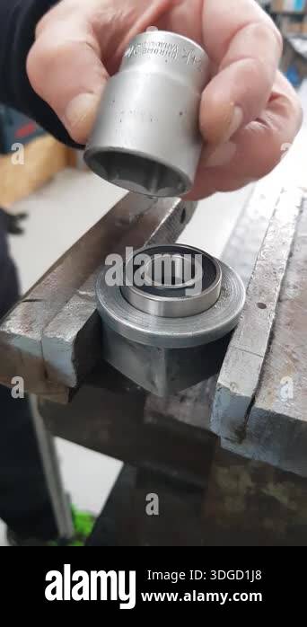 A mechanic installs a bearing into a bushing Stock Video Footage - Alamy