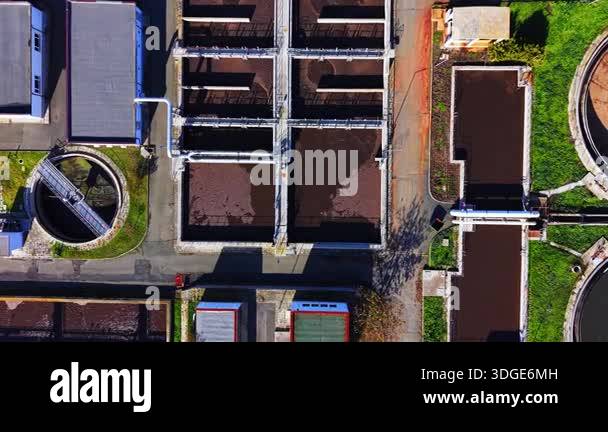 Facility with rectangular and circular tanks containing untreated water ...