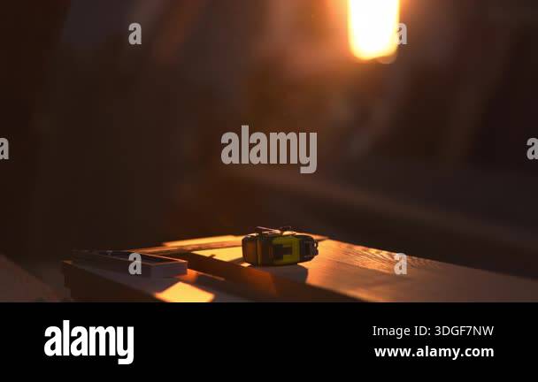 Tape Measure Resting On Wooden Bench In Golden Backlight, Close Framing ...