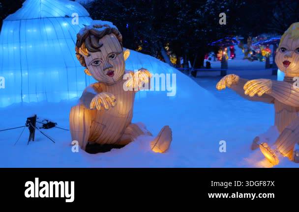 LVIV, UKRAINE - JANUARY 06, 2026: Illuminated ice sculptures create a ...