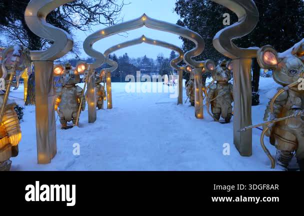 LVIV, UKRAINE - JANUARY 06, 2026: Golden mouse guards illuminate a ...