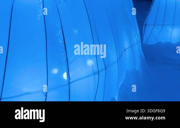 Illuminated futuristic structures in a winter park. Abstract blue light ...