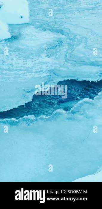 Aerial Icy Glacier Crevasse In Blue, Layered Ice Sheets Meeting Dark ...