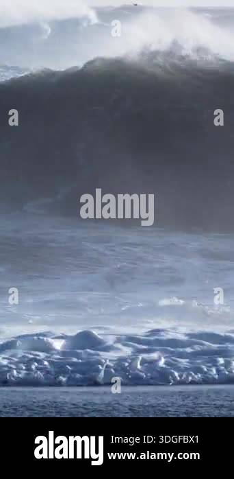 Vertical Screen: Storm in the ocean, huge waves crashing on the shore ...