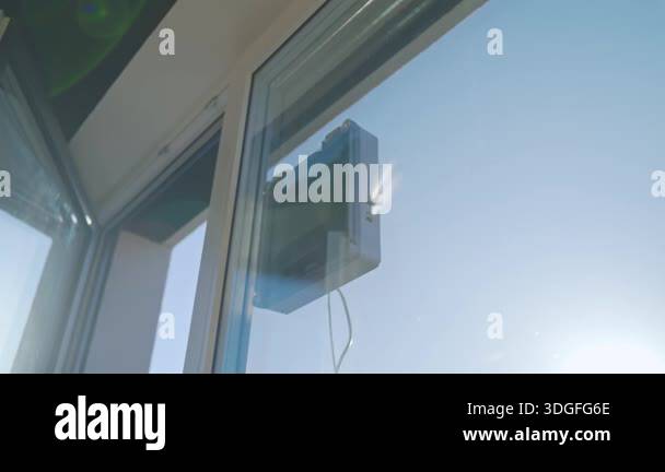 Square window cleaning robot washing glass. Robotic window cleaner ...