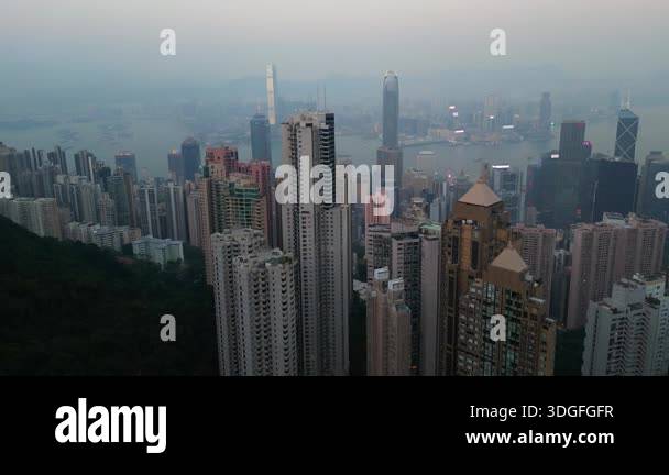 Ridge foreground frames crowded highrises while harbour opens beyond ...