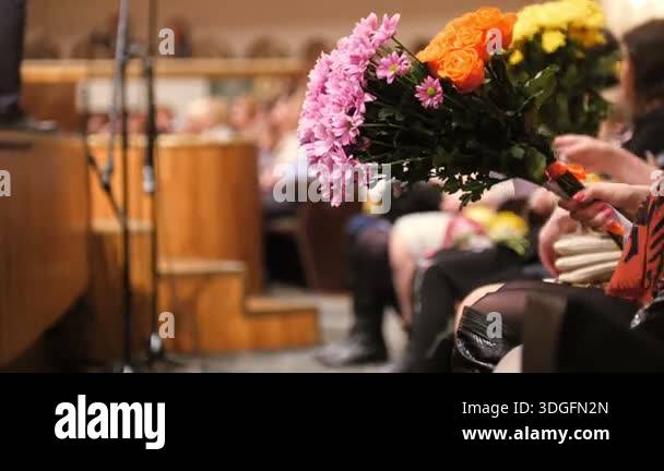Theater hall - spectators with flowers applauding the performance on ...