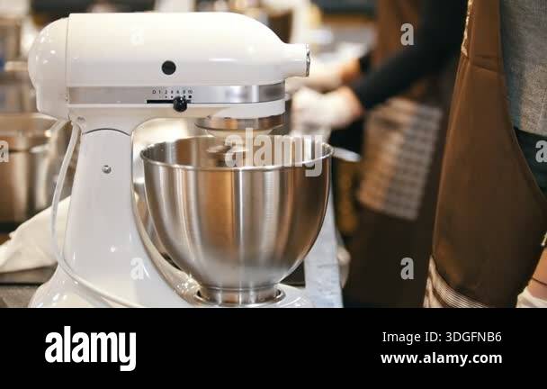 Kitchen - beats Egg near electric mixer - cooking cakes, close up Stock ...