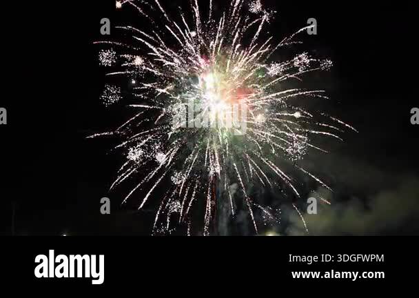 4K video of a vibrant fireworks display lighting up the night sky. The ...