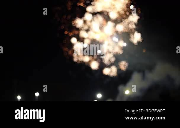 4K video of a vibrant fireworks display lighting up the night sky. The ...