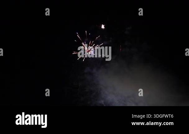 4K video of a vibrant fireworks display lighting up the night sky. The ...