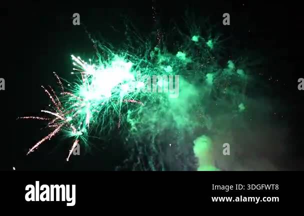 4K video of a vibrant fireworks display lighting up the night sky. The ...