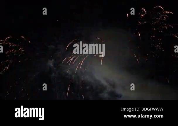 4K video of a vibrant fireworks display lighting up the night sky. The ...