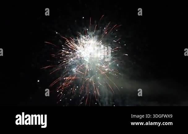 4K video of a vibrant fireworks display lighting up the night sky. The ...