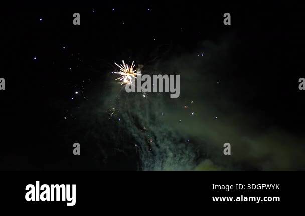4K video of a vibrant fireworks display lighting up the night sky. The ...