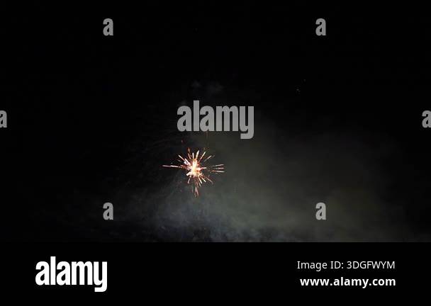 4K video of a vibrant fireworks display lighting up the night sky. The ...