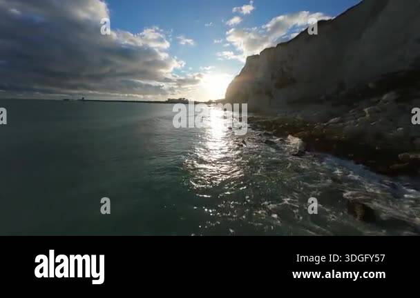 High-speed FPV aerial drone footage flying along the limestone ...