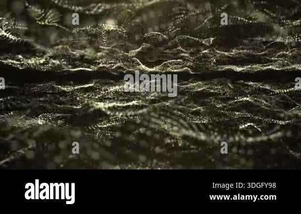 Digital orange and gold particles move against an abstract futuristic ...