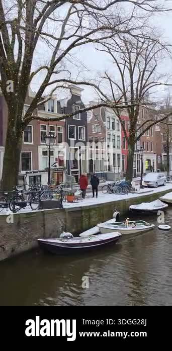 AMSTERDAM, NETHERLANDS - JANUARY 9, 2026: Amsterdam canal in winter ...