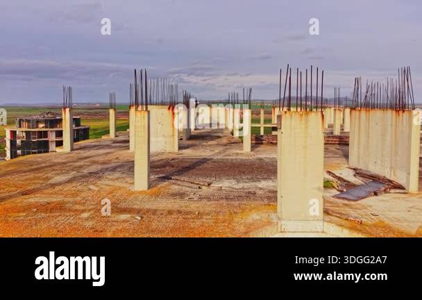 An aerial view showcases an abandoned construction site with concrete ...