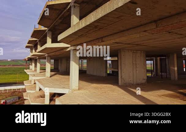 Aerial view of an incomplete building structure showcasing concrete ...