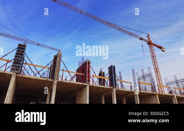 Aerial view of a construction site showing cranes and scaffolding ...