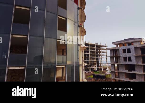 An aerial view of a construction site with modern buildings taking ...