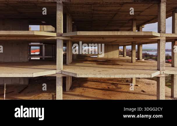 Aerial view of a partially constructed building with empty floors and ...